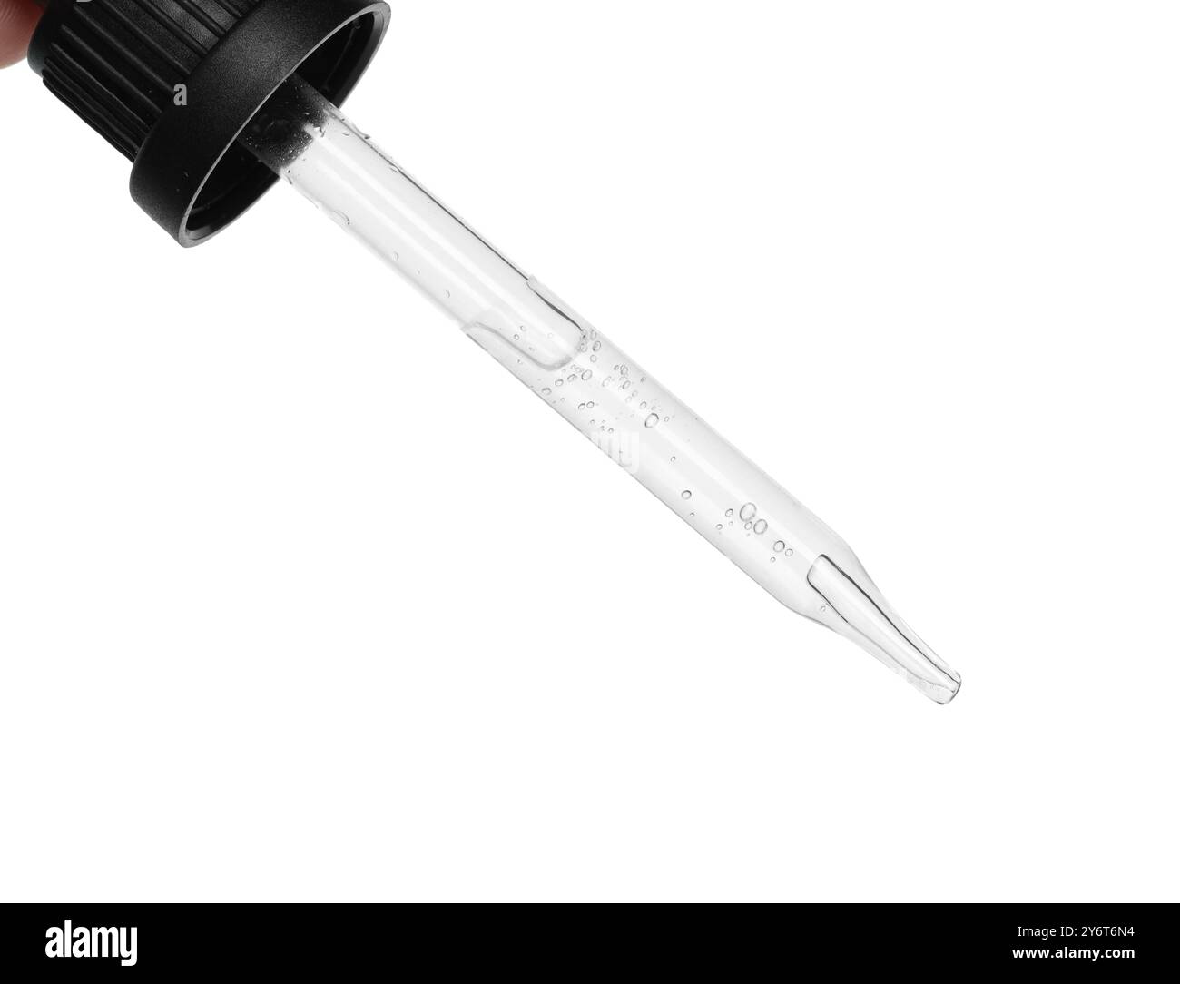 Dripping cosmetic serum from pipette on white background Stock Photo ...