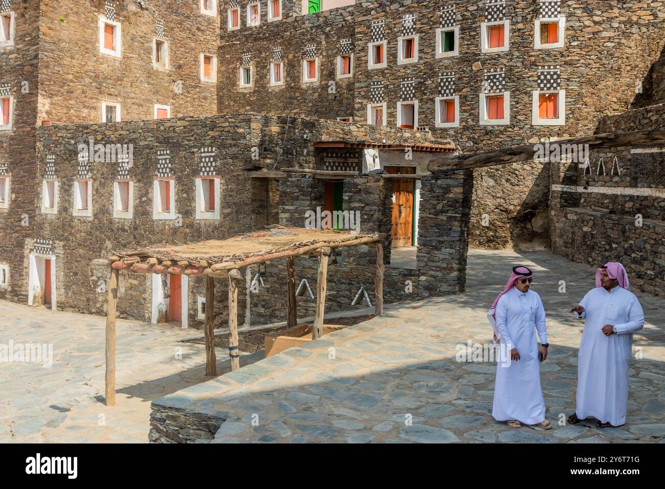 RIJAL ALMA, SAUDI ARABIA - NOVEMBER 20, 2021: Local men in ancient ...