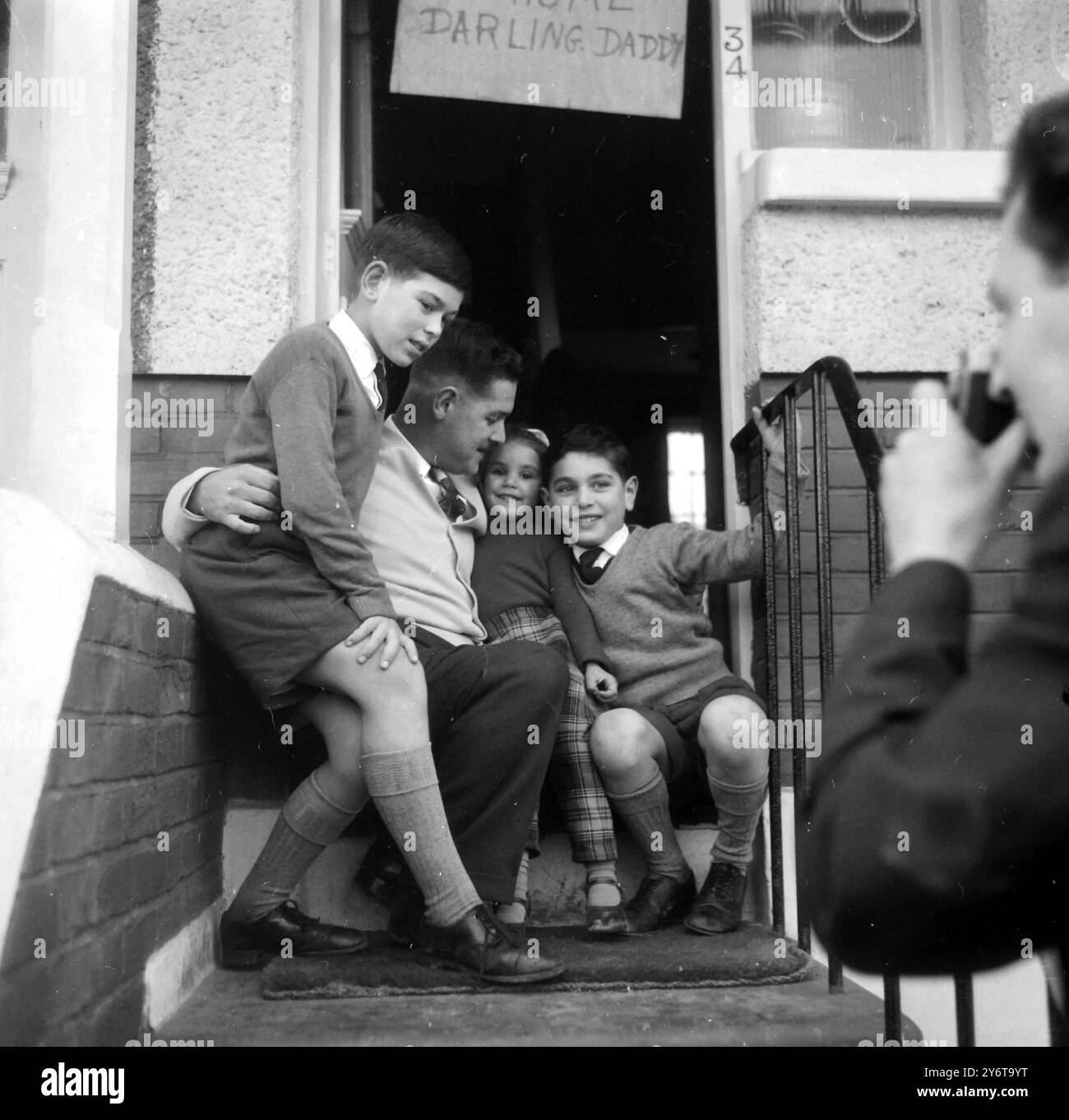 Reunited with families hi-res stock photography and images - Alamy