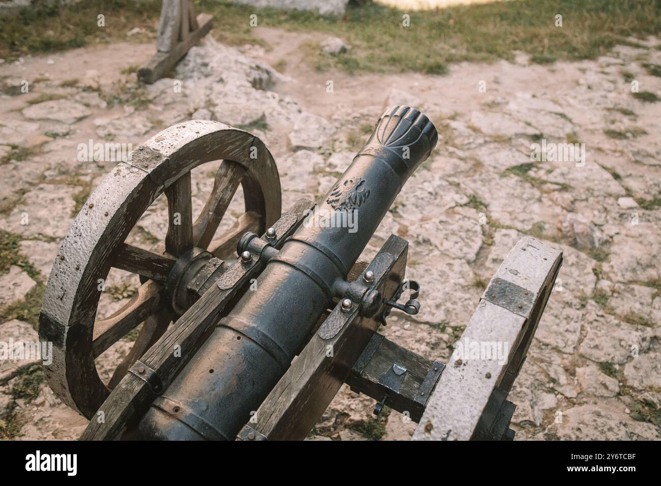 Cannon on a carriage located on a white stone pedestal near the arsenal ...