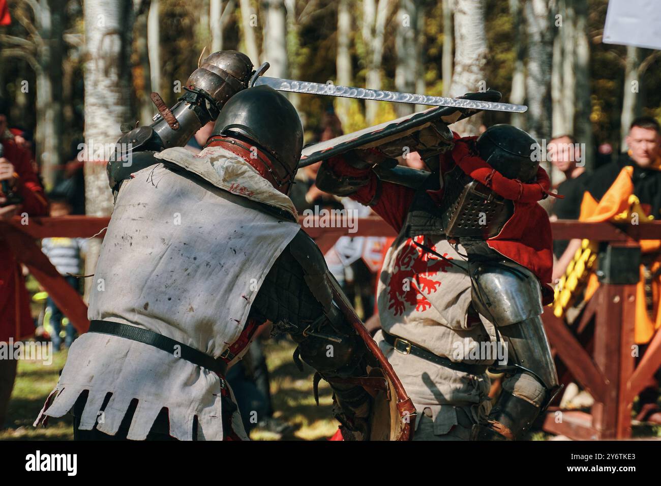 Two knights with shields fight with swords in the arena Stock Photo - Alamy