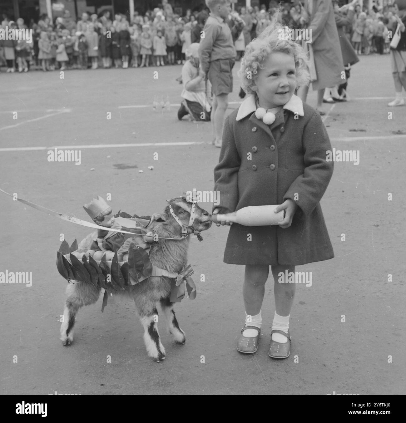 GAIL BURGESS WITH A SMALL GOAT 12 OCTOBER 1961 Stock Photo - Alamy