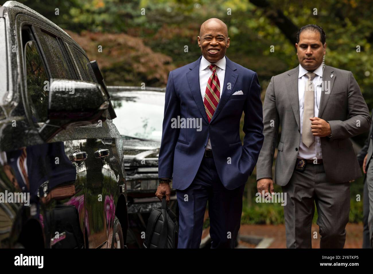 New York City Mayor Eric Adams, left, exits Gracie Mansion, the ...