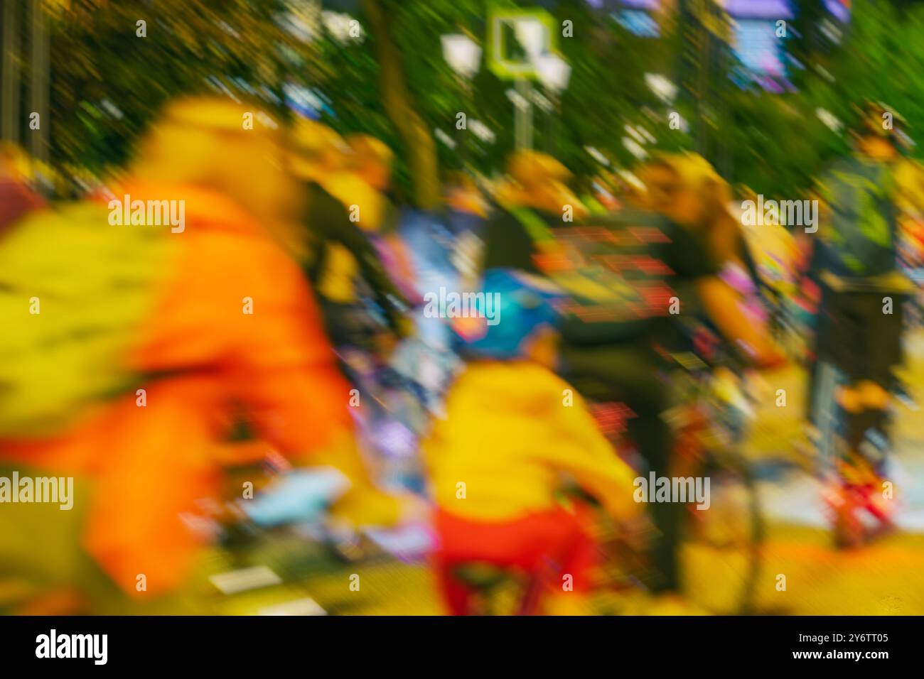 Blurred background of busy street filled with cyclists during twilight ...