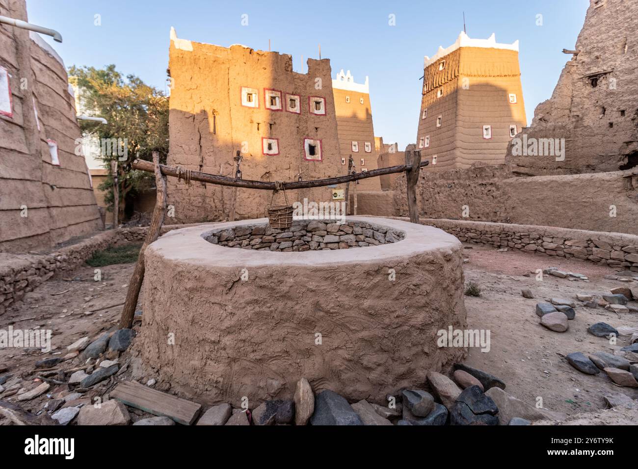 Old well and mud-brick houses in Dhahran al Janub, Saudi Arabia Stock ...