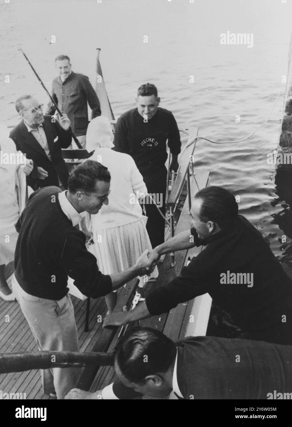 QUEEN FABIOLA WITH KING BAUDOUIN OF BELGIUM SHAKES HANDS WITH YACHTSMAN ...