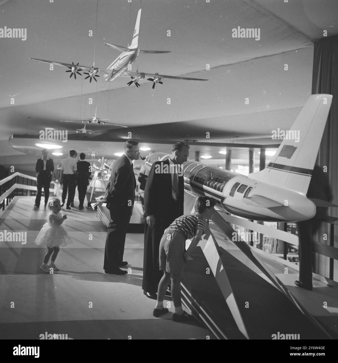VISITORS WATCH A PLANE MODEL AT SOVIET EXHIBITION IN LONDON 7 JULY 1961 ...