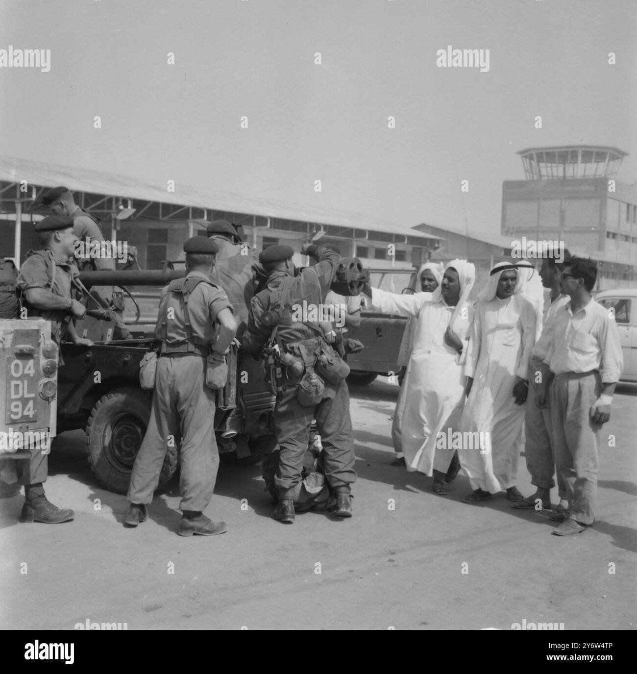 BRITISH ARMY PARACHUTE WATCHED BY KUWAIT OFFICIALS LOAD ANTI TANK GUNS ...