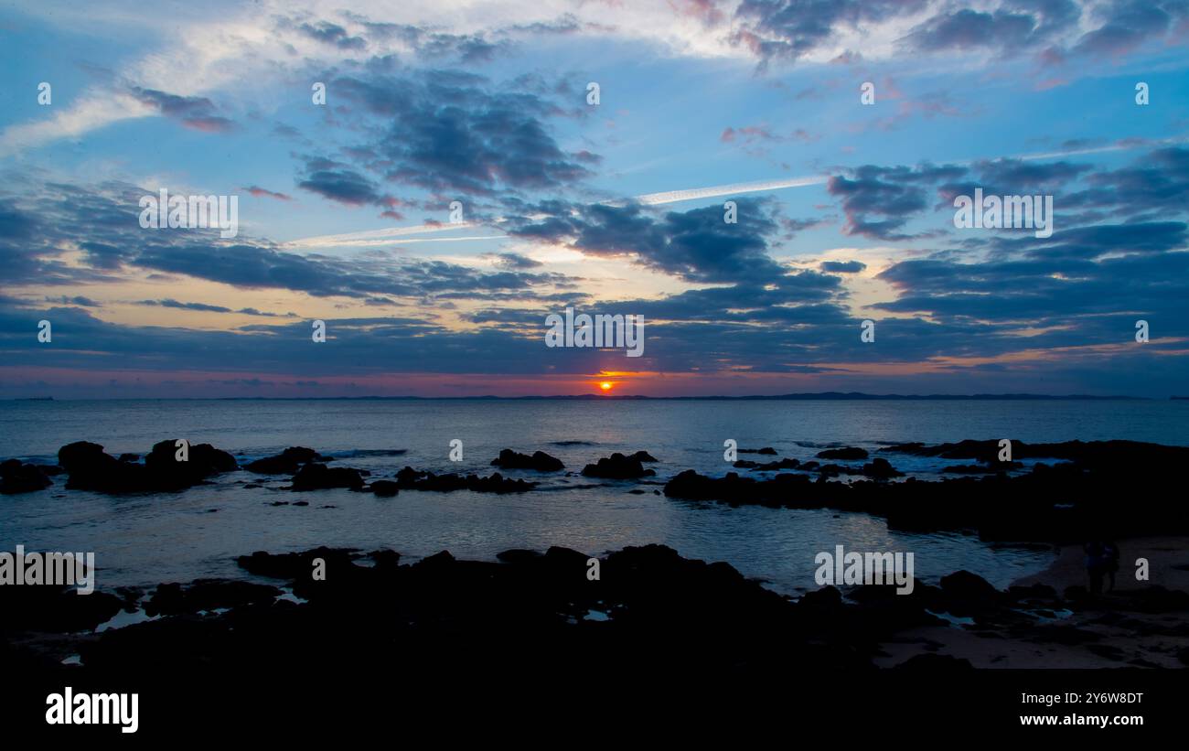 Beautiful dramatic and impressive sunset with dark and dense clouds ...