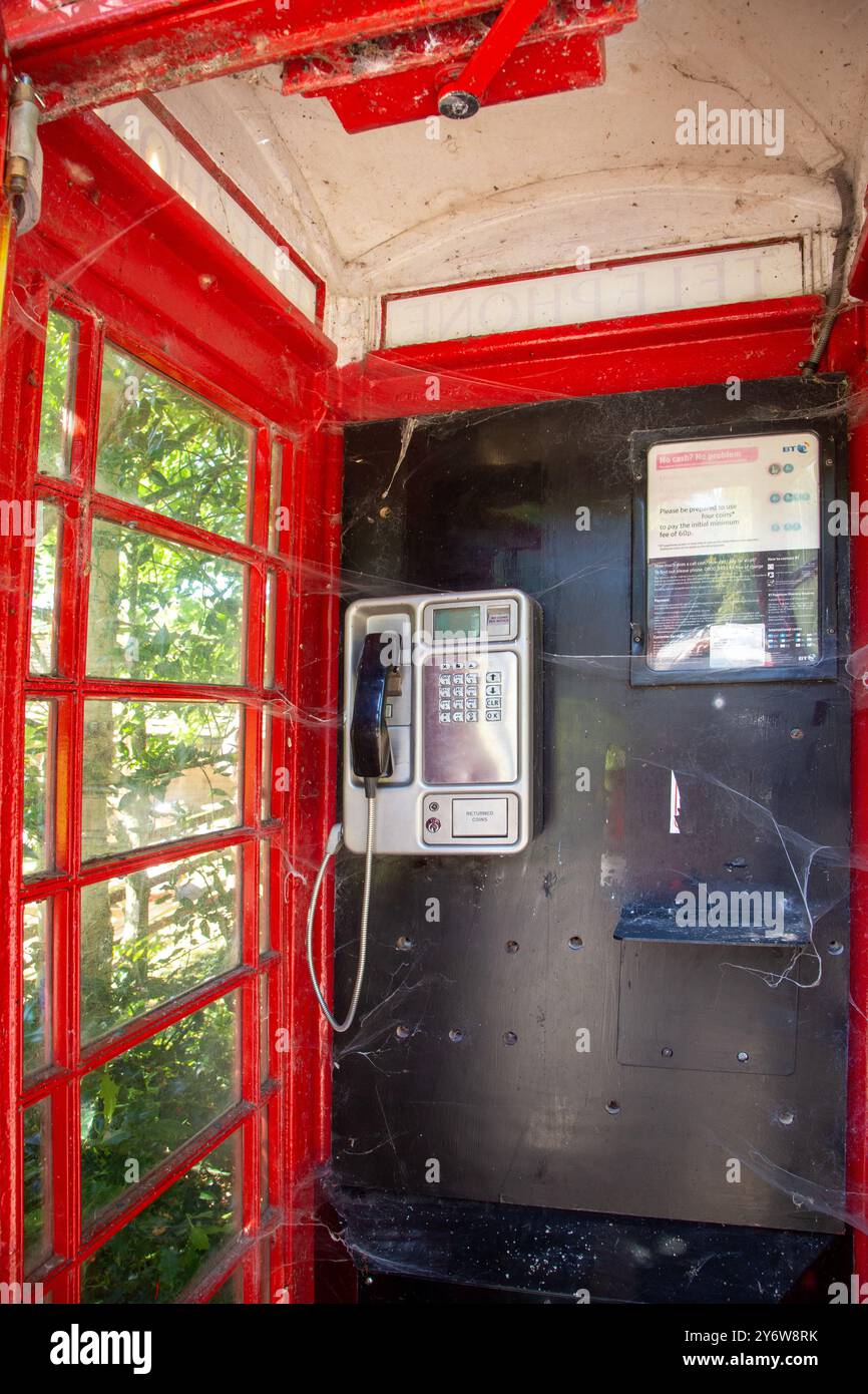 Telephone in an traditional red English telephone box kiosk design no 6 / K6 designed in 1935 by ...