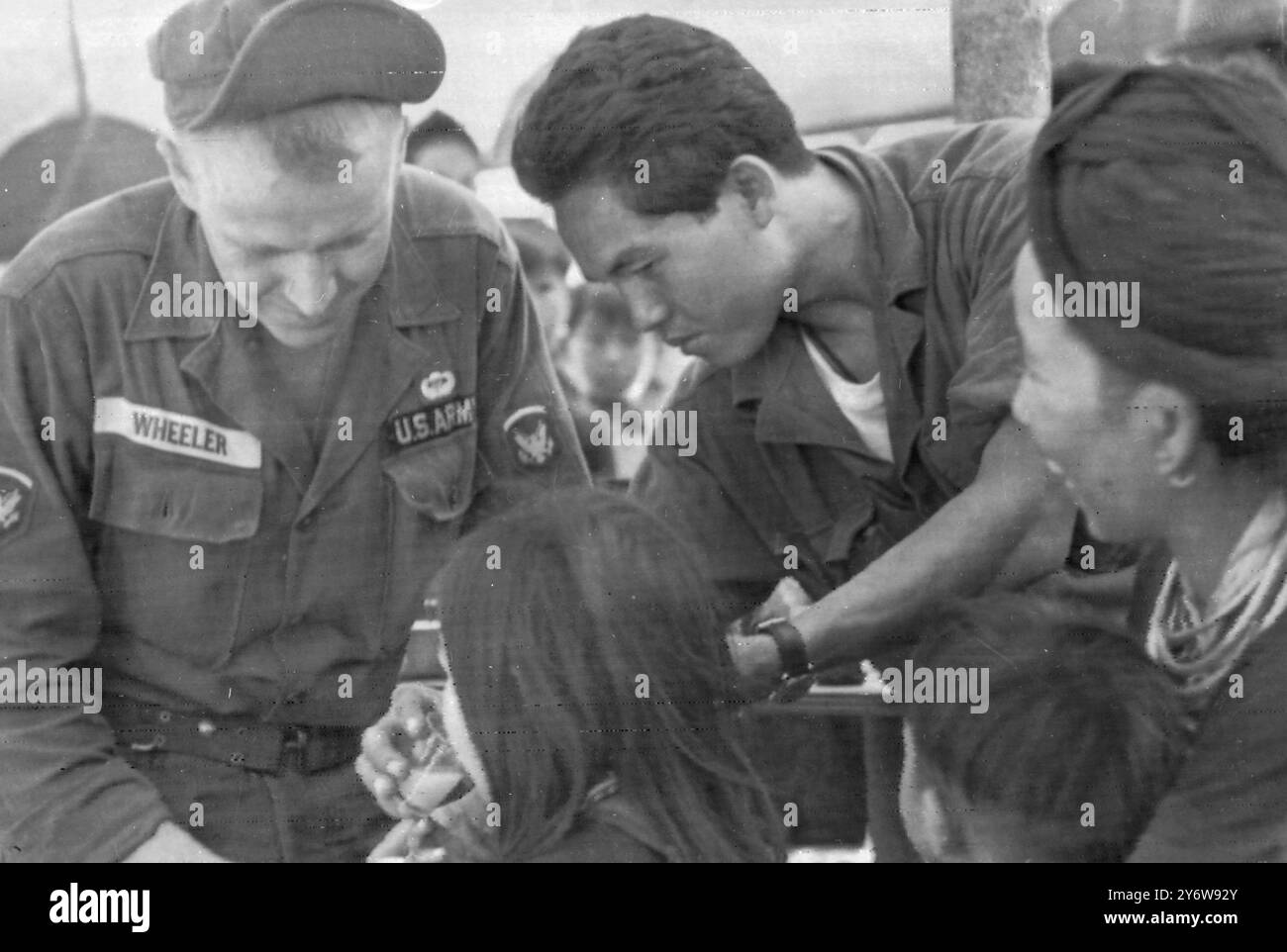DOCTORS MEDICAL OFFICER HELPS SICK NATIVES IN LAOS 24 MAY 1961 Stock ...
