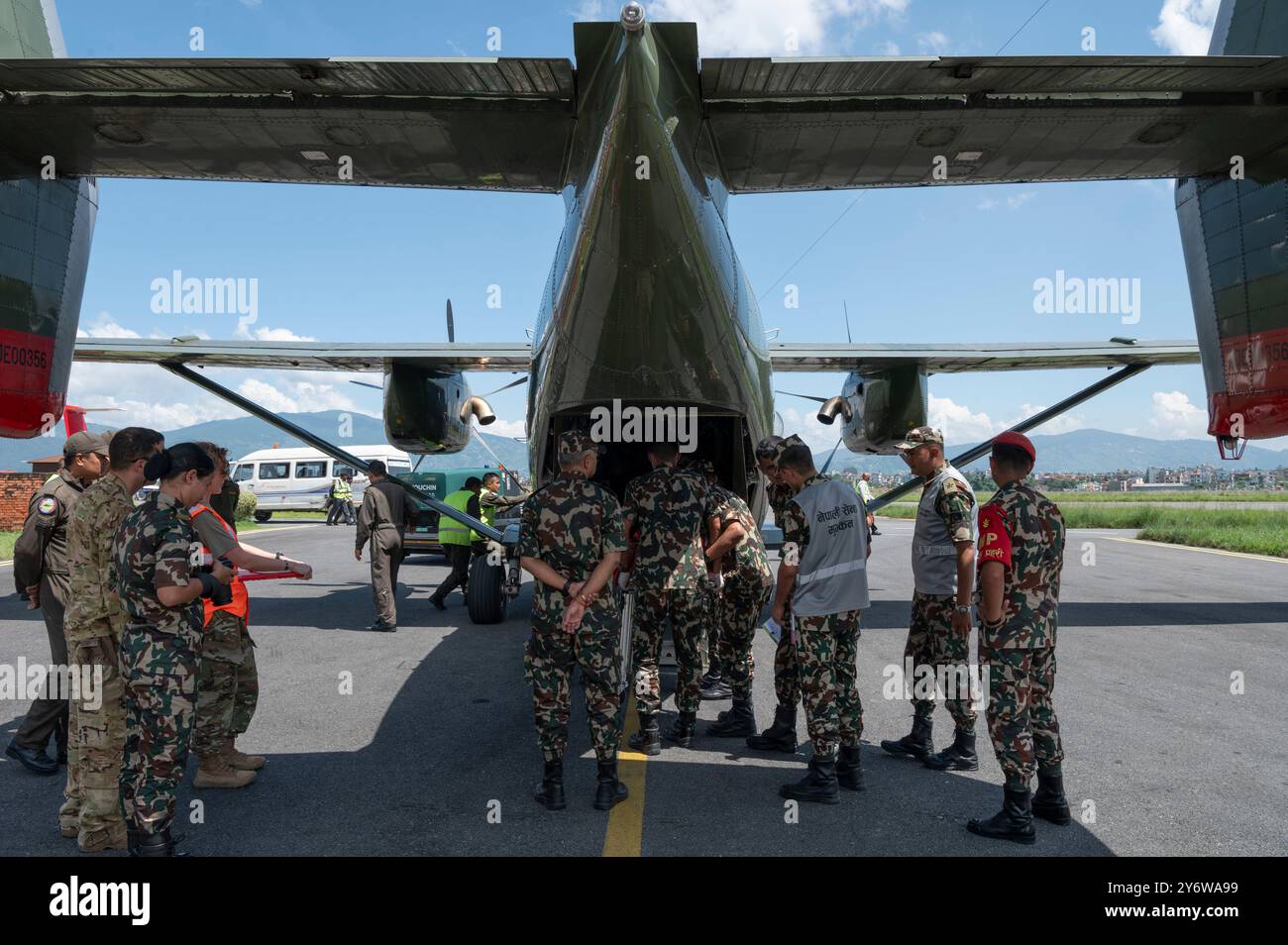 U.S. Air Force members assigned to Pacific Air Forces and Nepali Army members load a patient ...