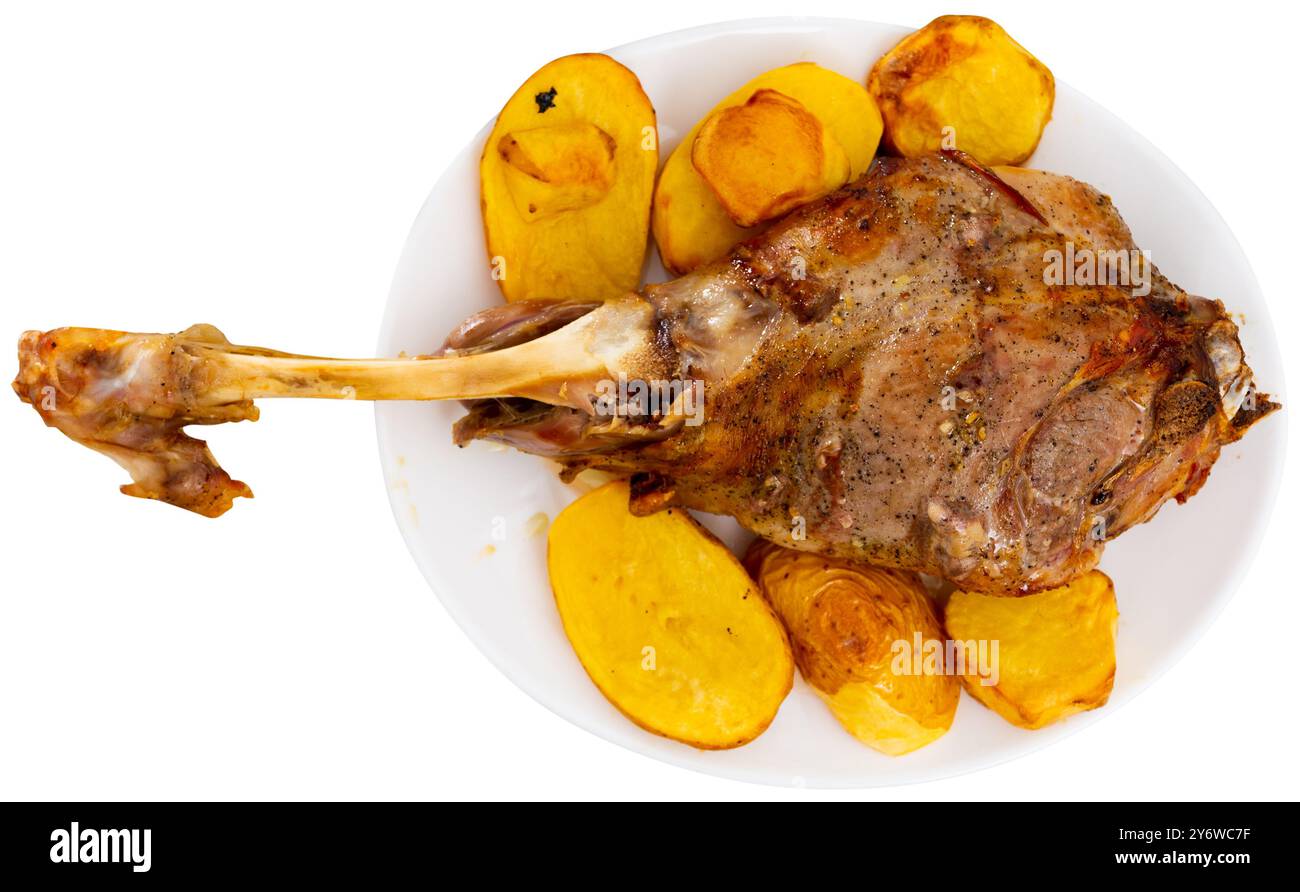 Traditional Spanish lunch is served - fried baked leg of lamb with side ...