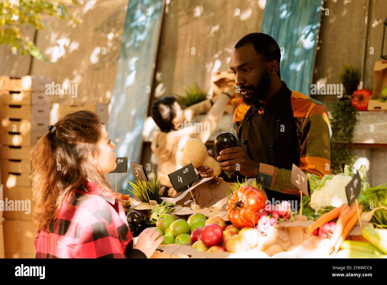 Black man showing natural healthy products from farmers market stand ...