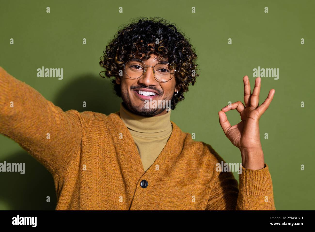 Photo portrait of attractive young man take selfie photo show okey dressed stylish brown clothes ...