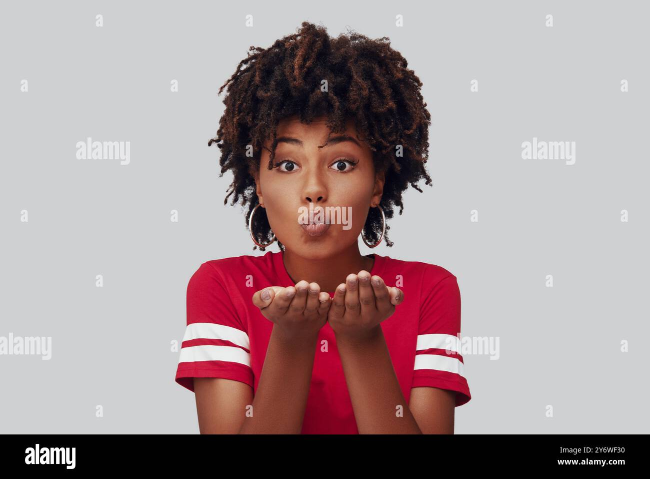 Attractive Young African Woman Looking At Camera And Blowing A Kiss 2838