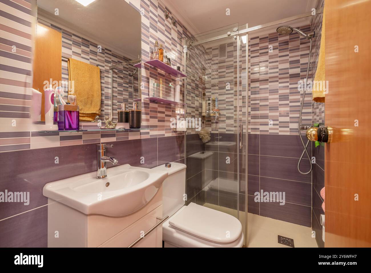 A conventional bathroom with a flat-floor shower cabin, frameless ...