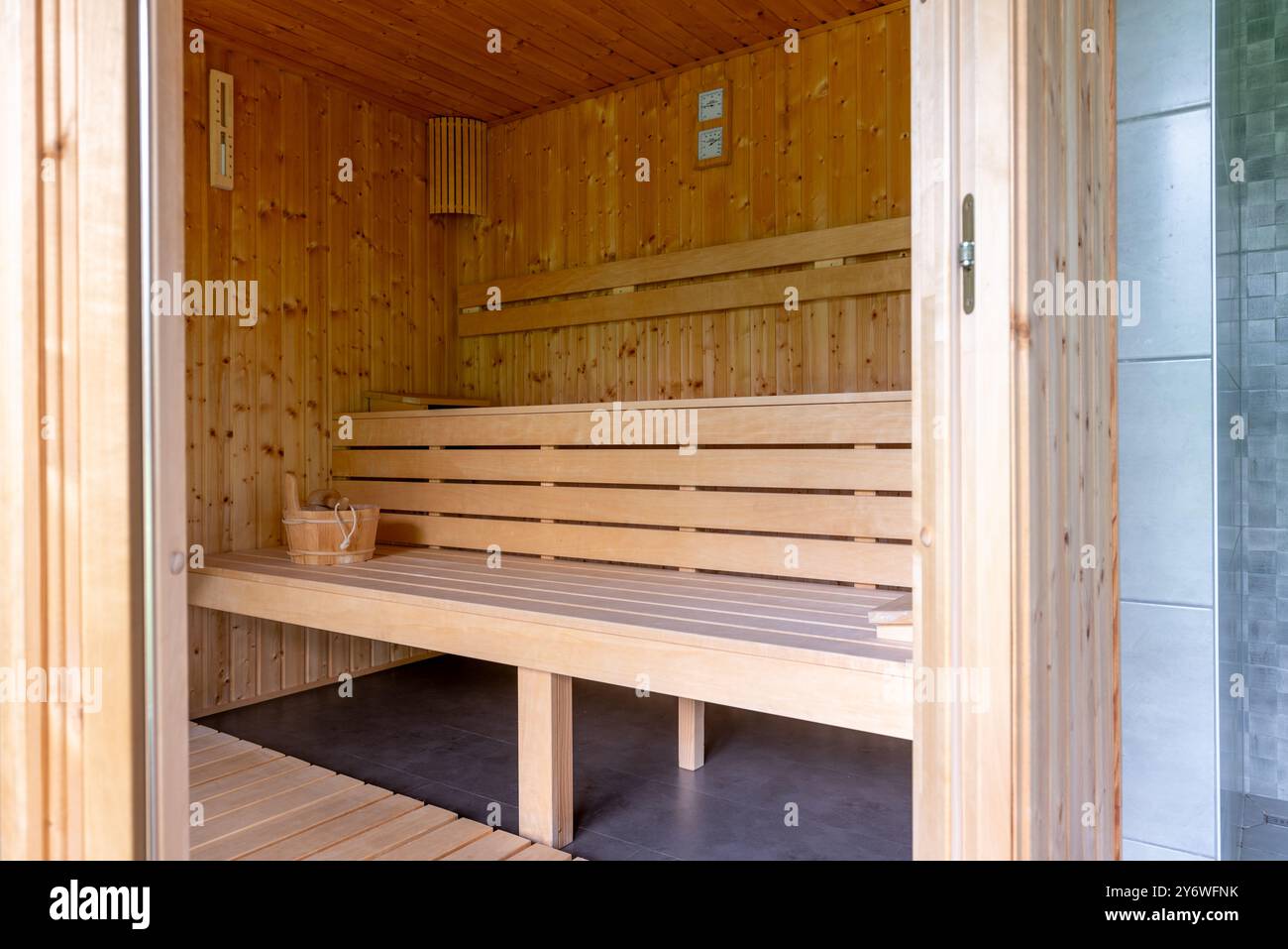 Wooden Sauna With Benches. The sauna is empty. The wooden benches ...
