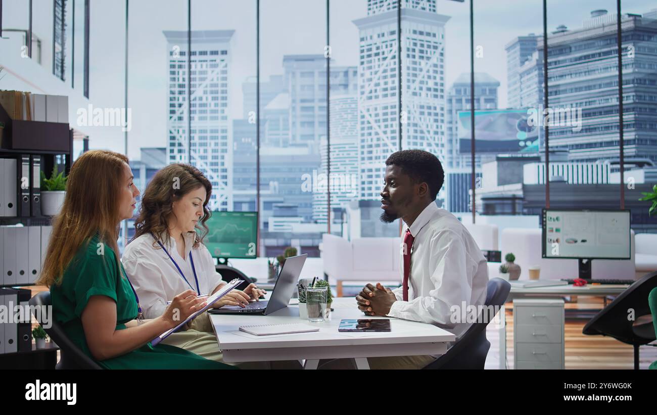 Team employers questioning job applicant hi-res stock photography and ...