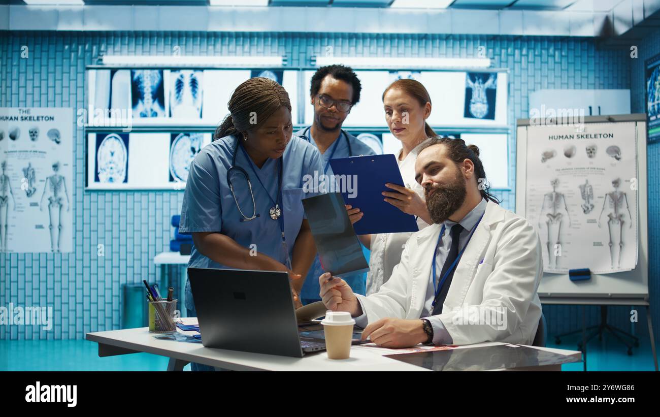 Doctors team review human anatomy scans to develop treatment plans ...