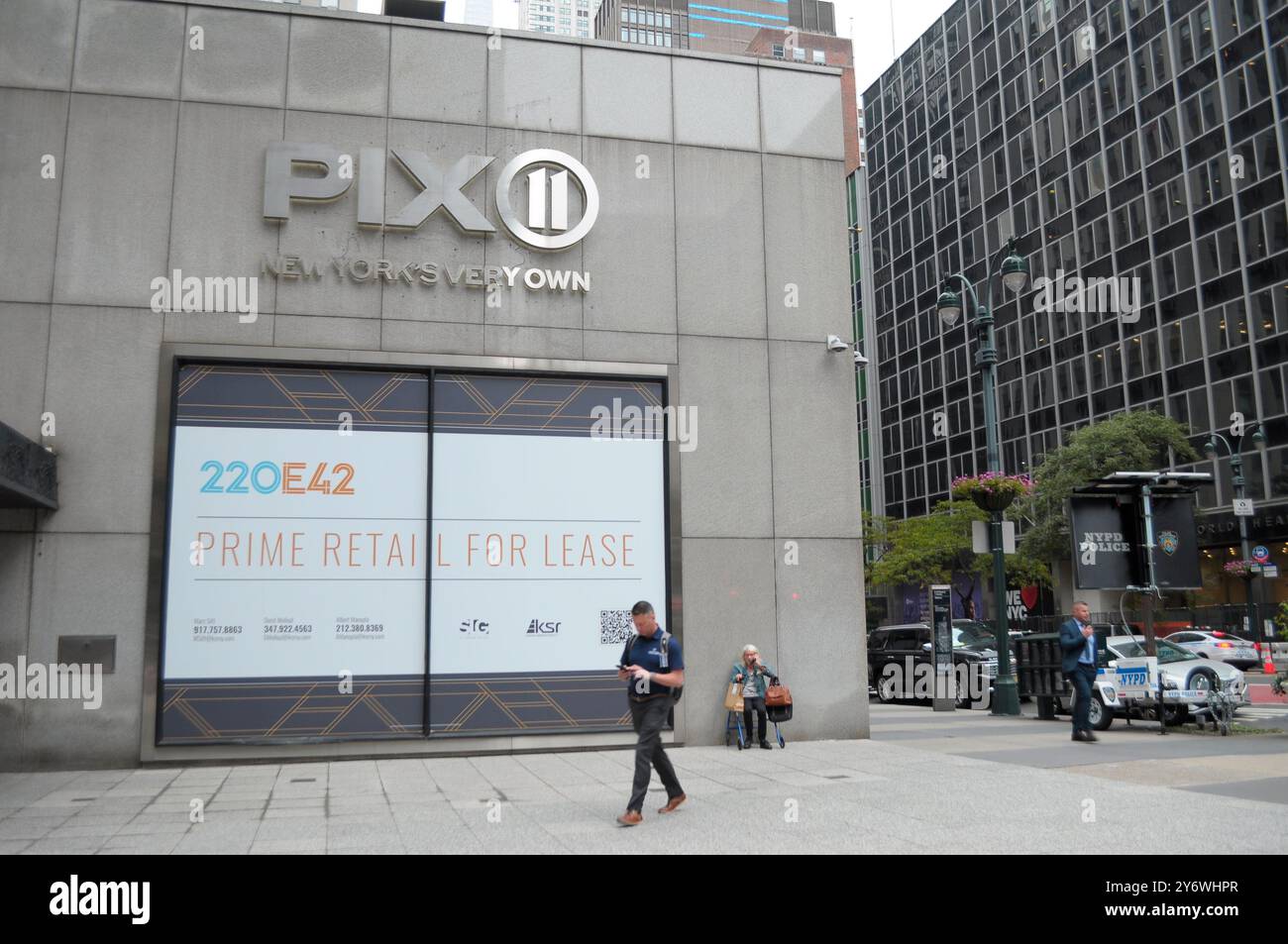 People walk past the PIX11 News building in Manhattan, New York City ...