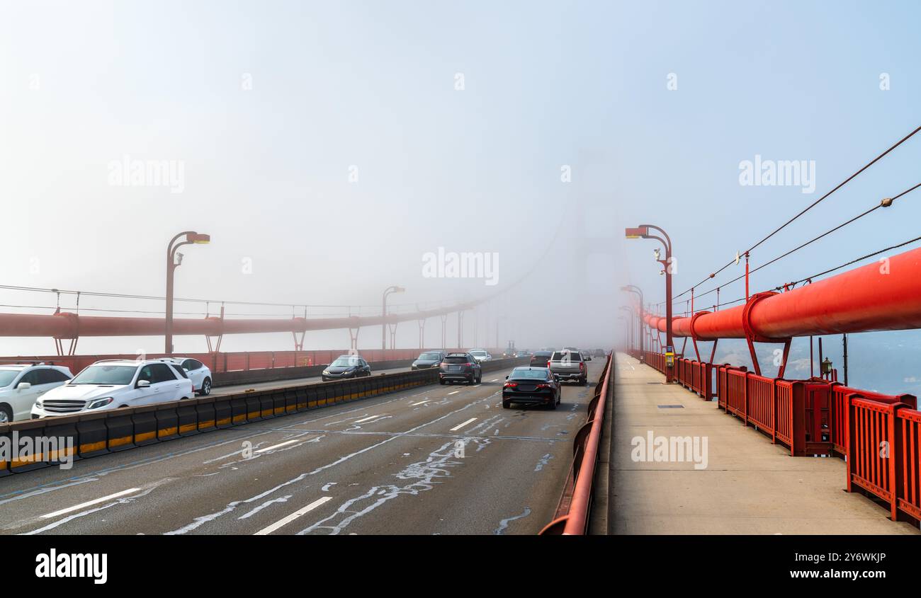 Golden Gate Bridge in fog. Major tourist attraction in San Francisco ...