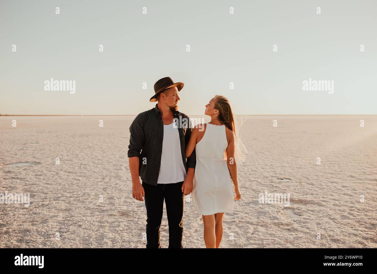 romantic photoshoot of young couple in love blond Europeans tanned ...