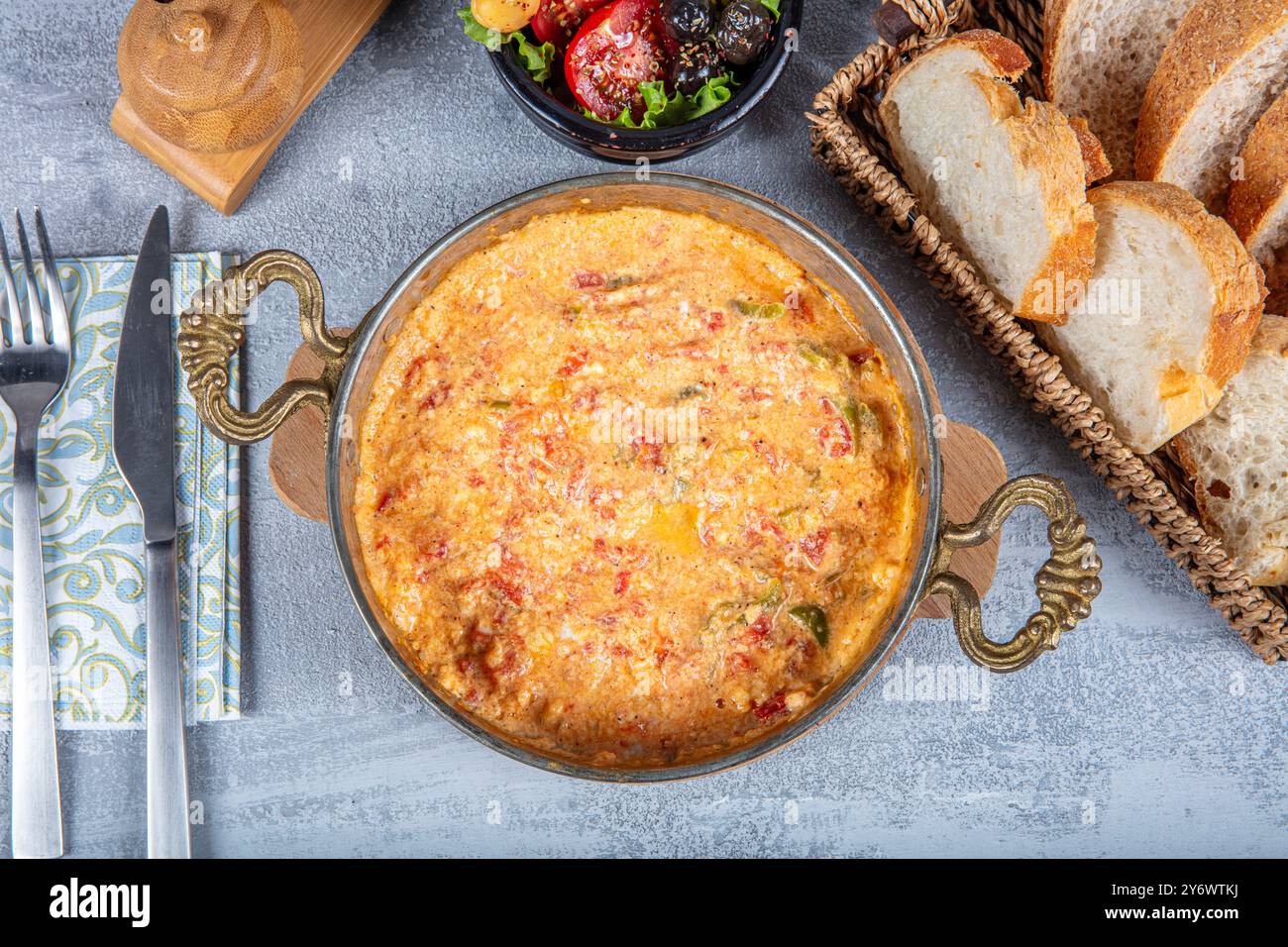 Famous Turkish name menemen in traditional copper pan. Menemen made ...