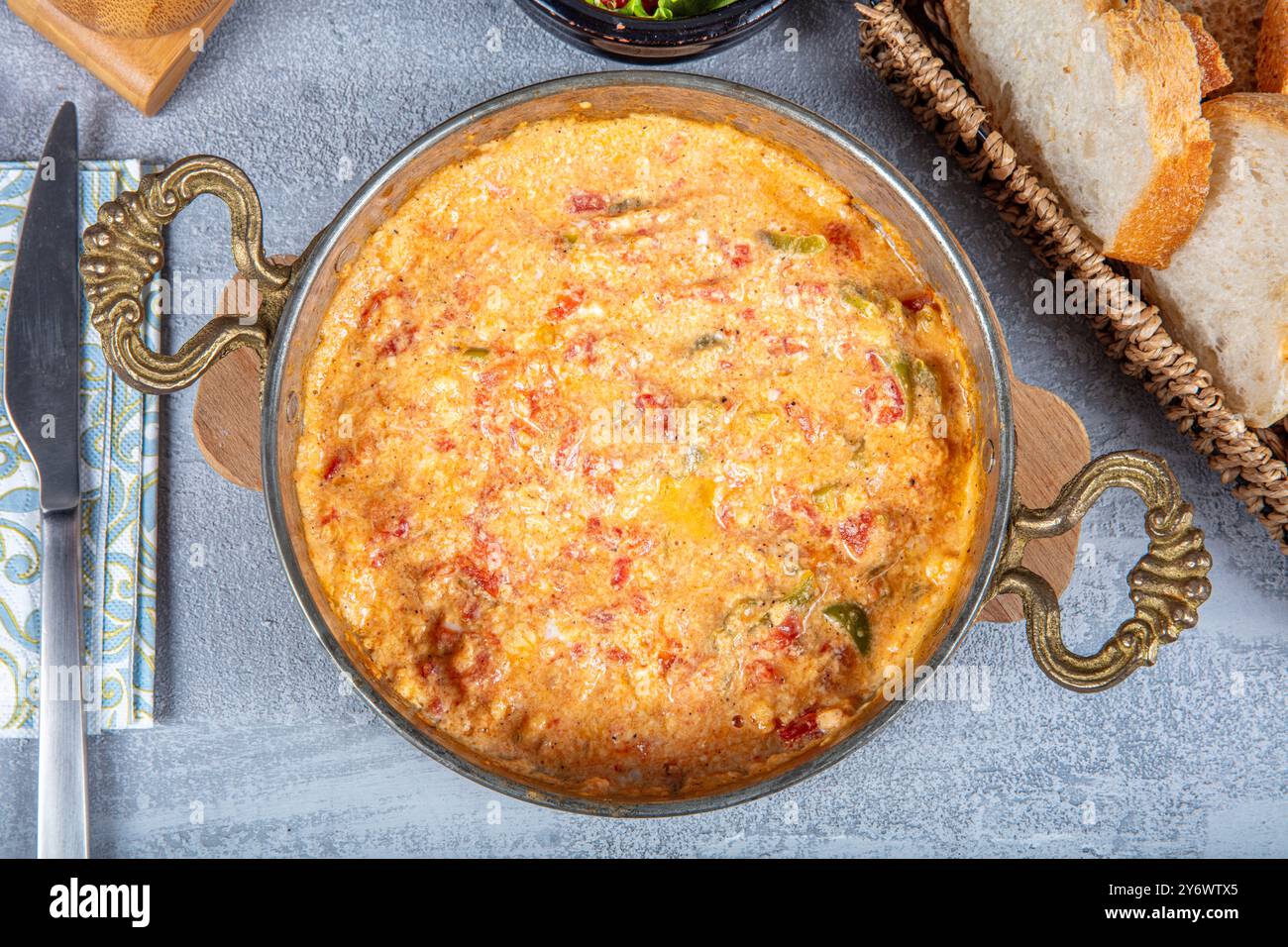 Famous Turkish name menemen in traditional copper pan. Menemen made ...