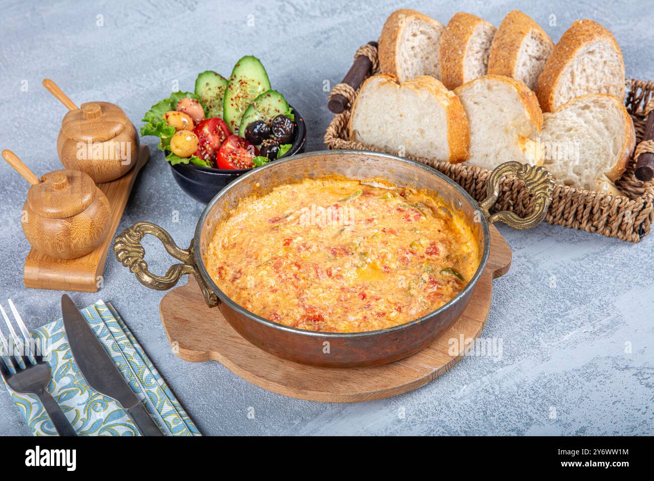 Famous Turkish name menemen in traditional copper pan. Menemen made ...