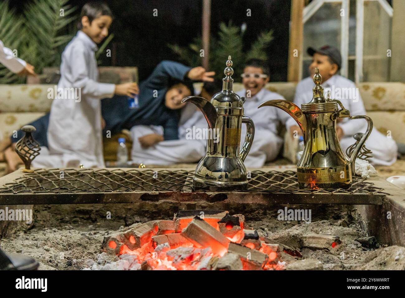 Coffee kettles with Yam tribe children in the background in Najran ...