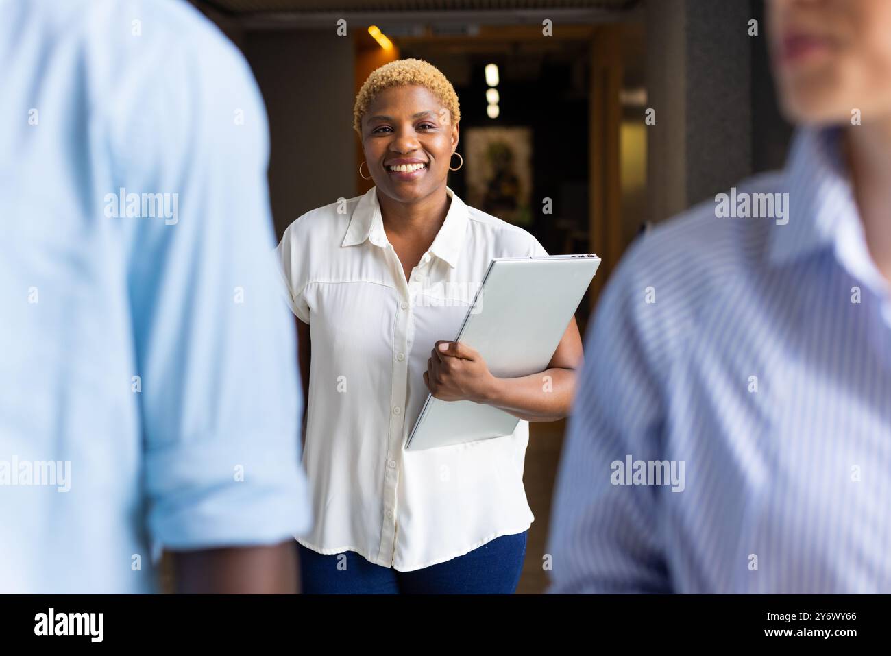 Colleagues engaging in teamwork hi-res stock photography and images - Alamy