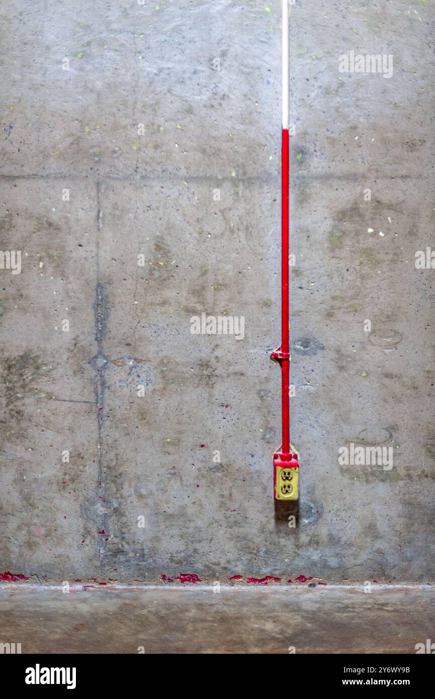 Double socket on concrete wall Stock Photo - Alamy