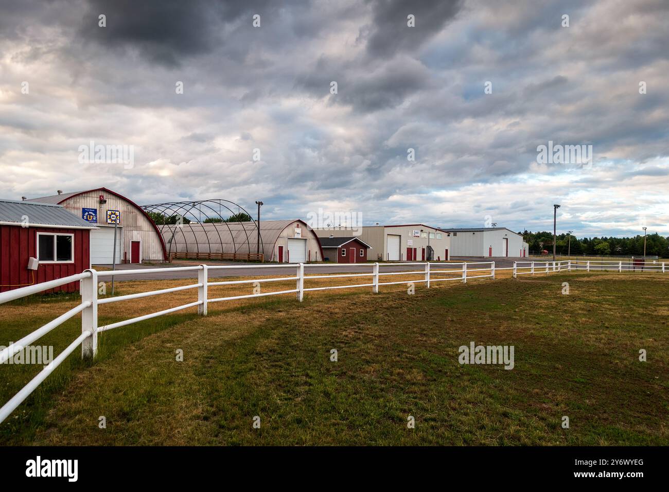 commercial buildings outside a white coral fence Stock Photo - Alamy