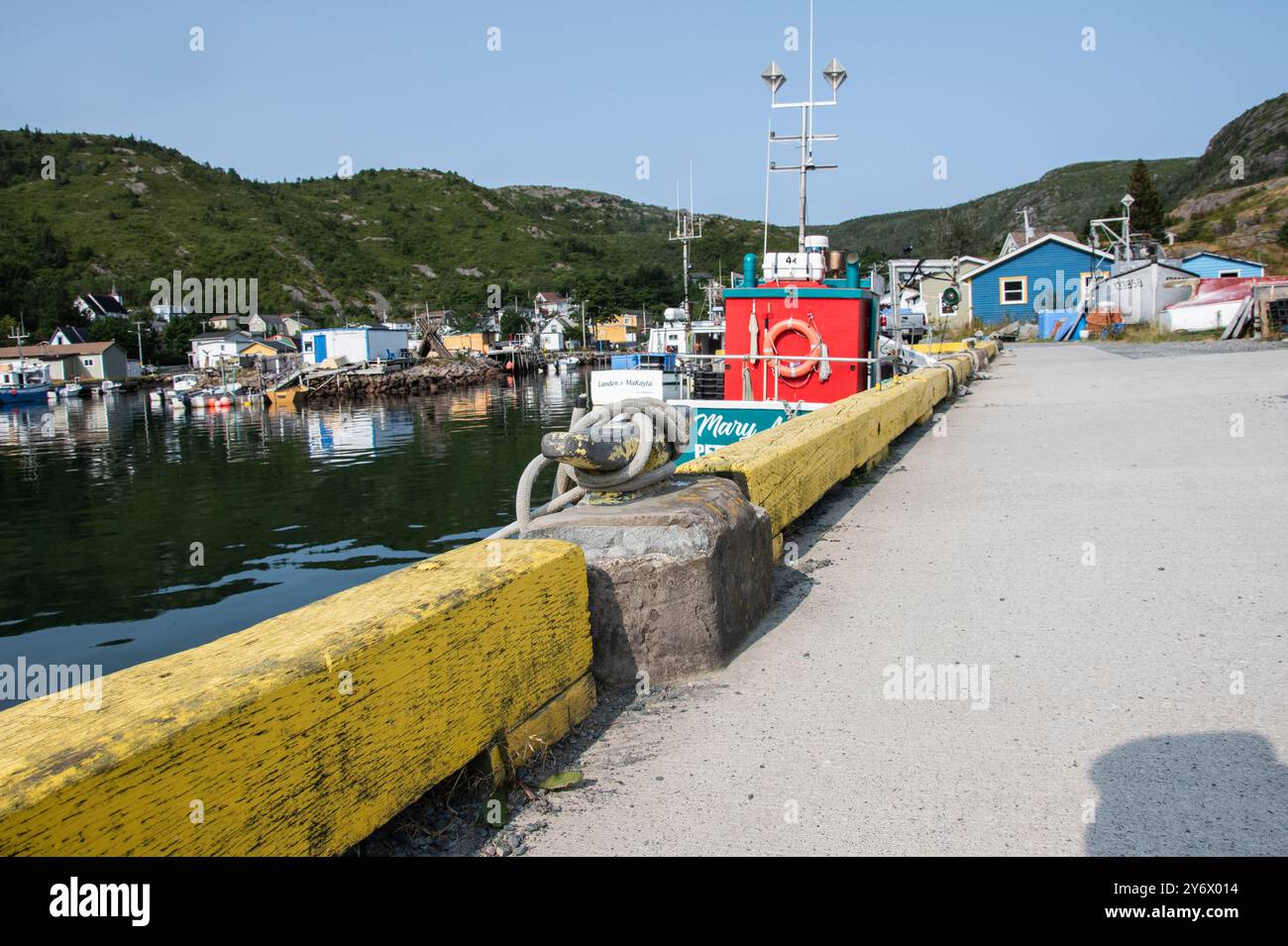 Fishing boats tied up at the dock in Petty Harbour–Maddox Cove ...