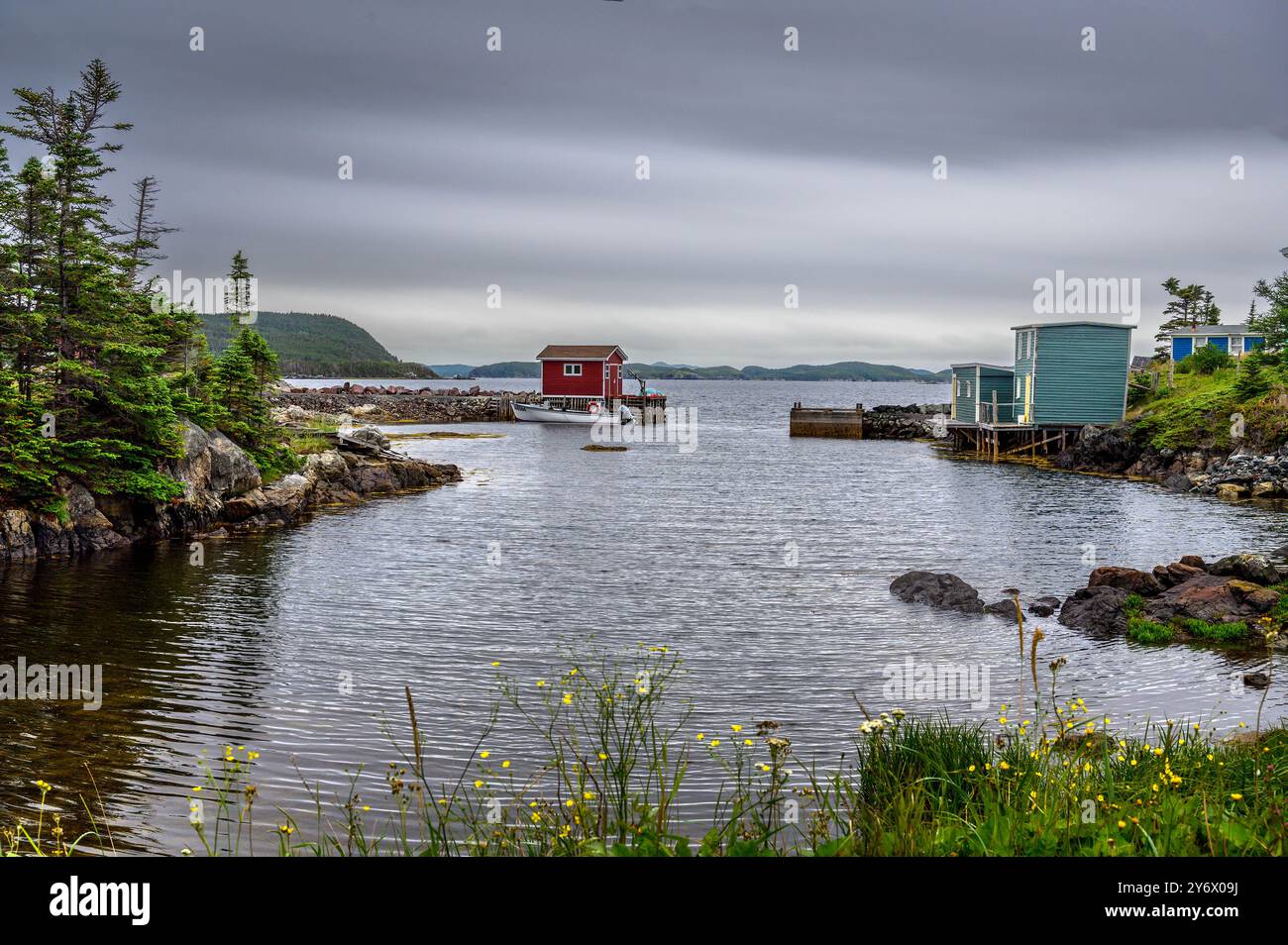 a small harbour created by a breakwater shelters small boats Stock ...