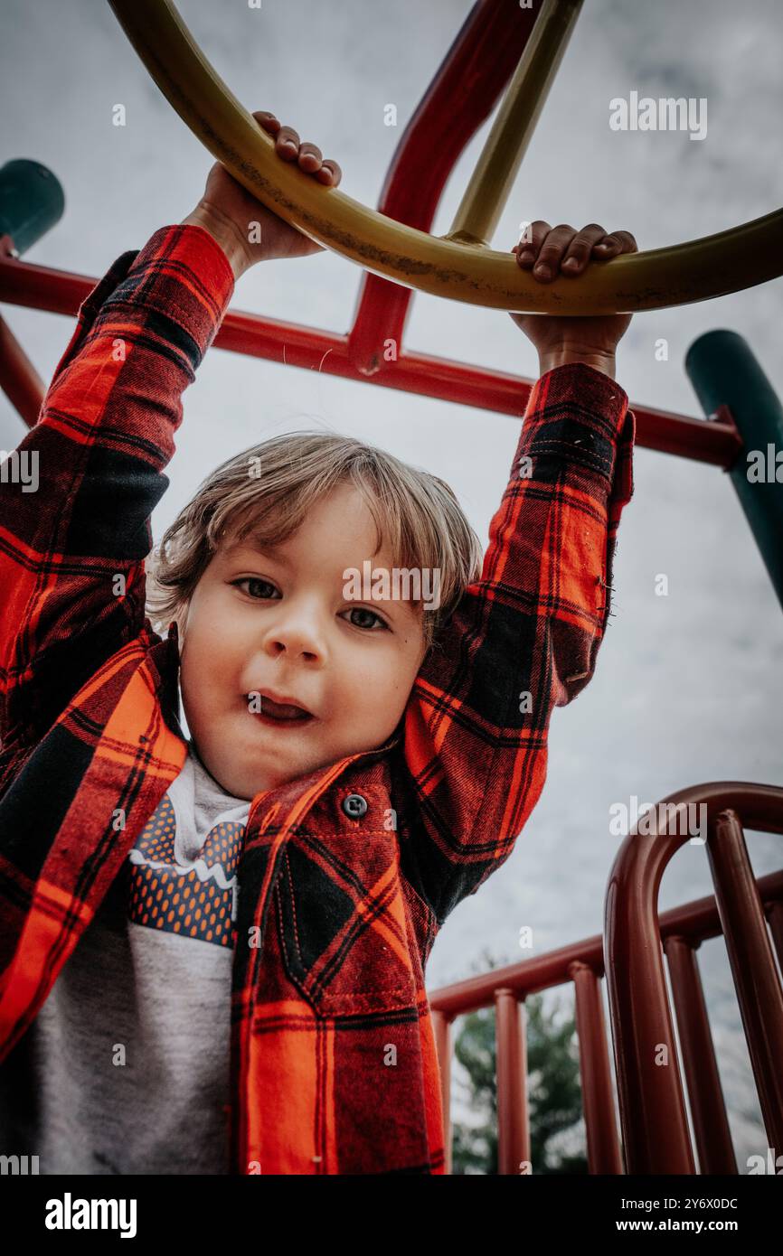 boy playing on playground in fall Stock Photo - Alamy