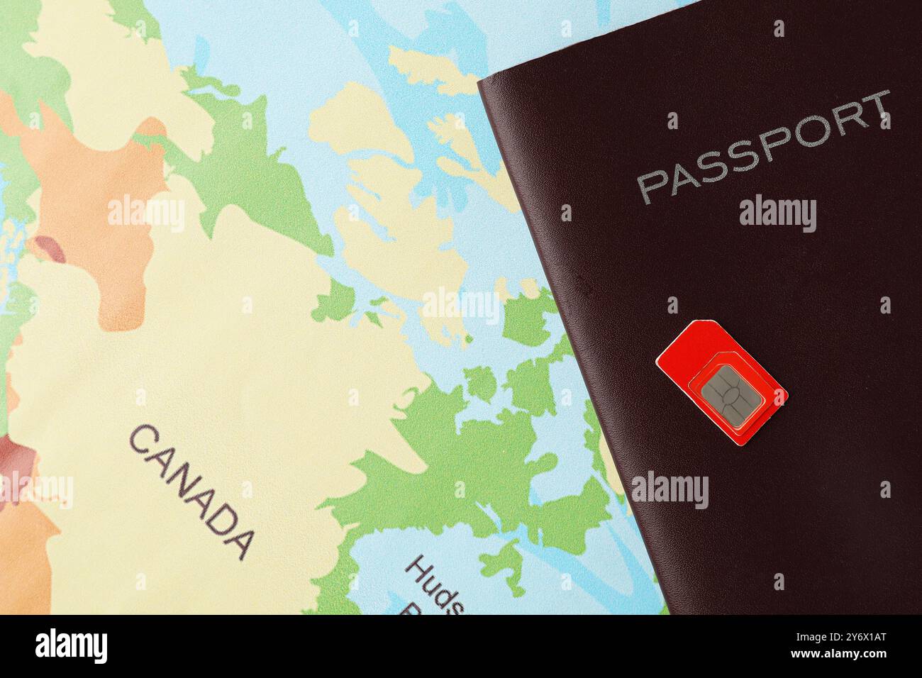 Passport and Sim card on world map, top view Stock Photo - Alamy