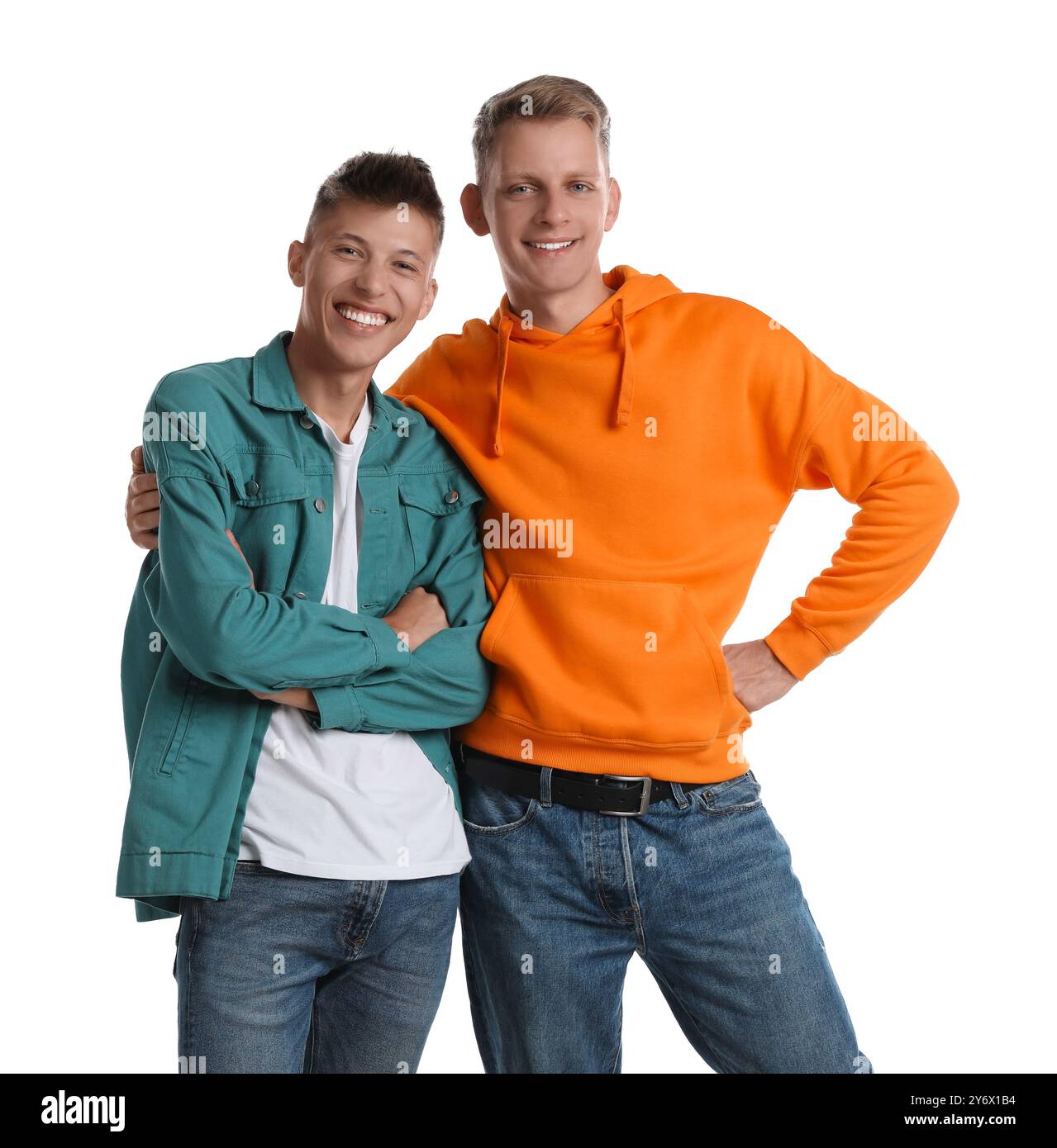 Two happy brothers posing on white background Stock Photo - Alamy