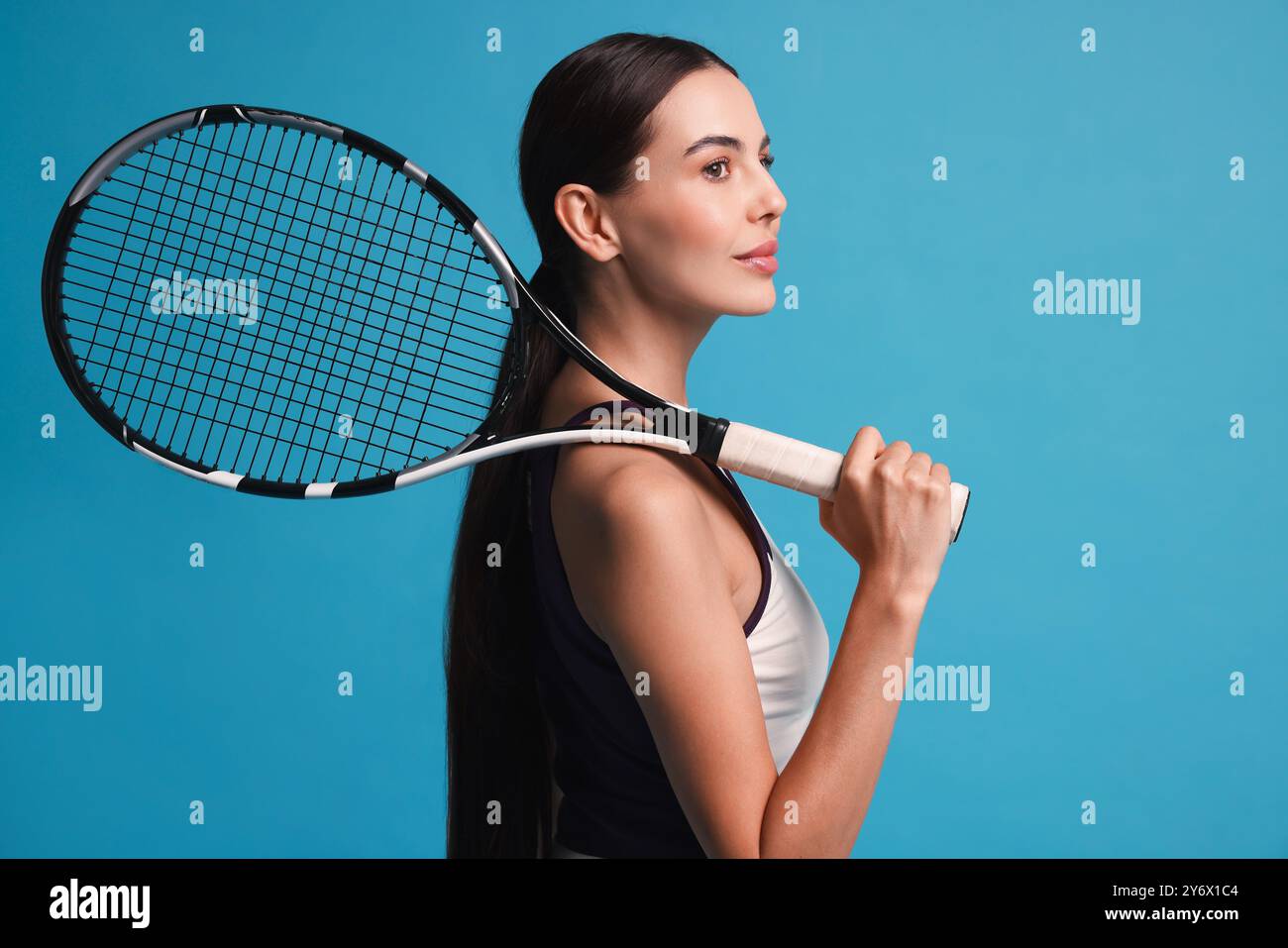 Beautiful young woman with tennis racket on light blue background Stock ...