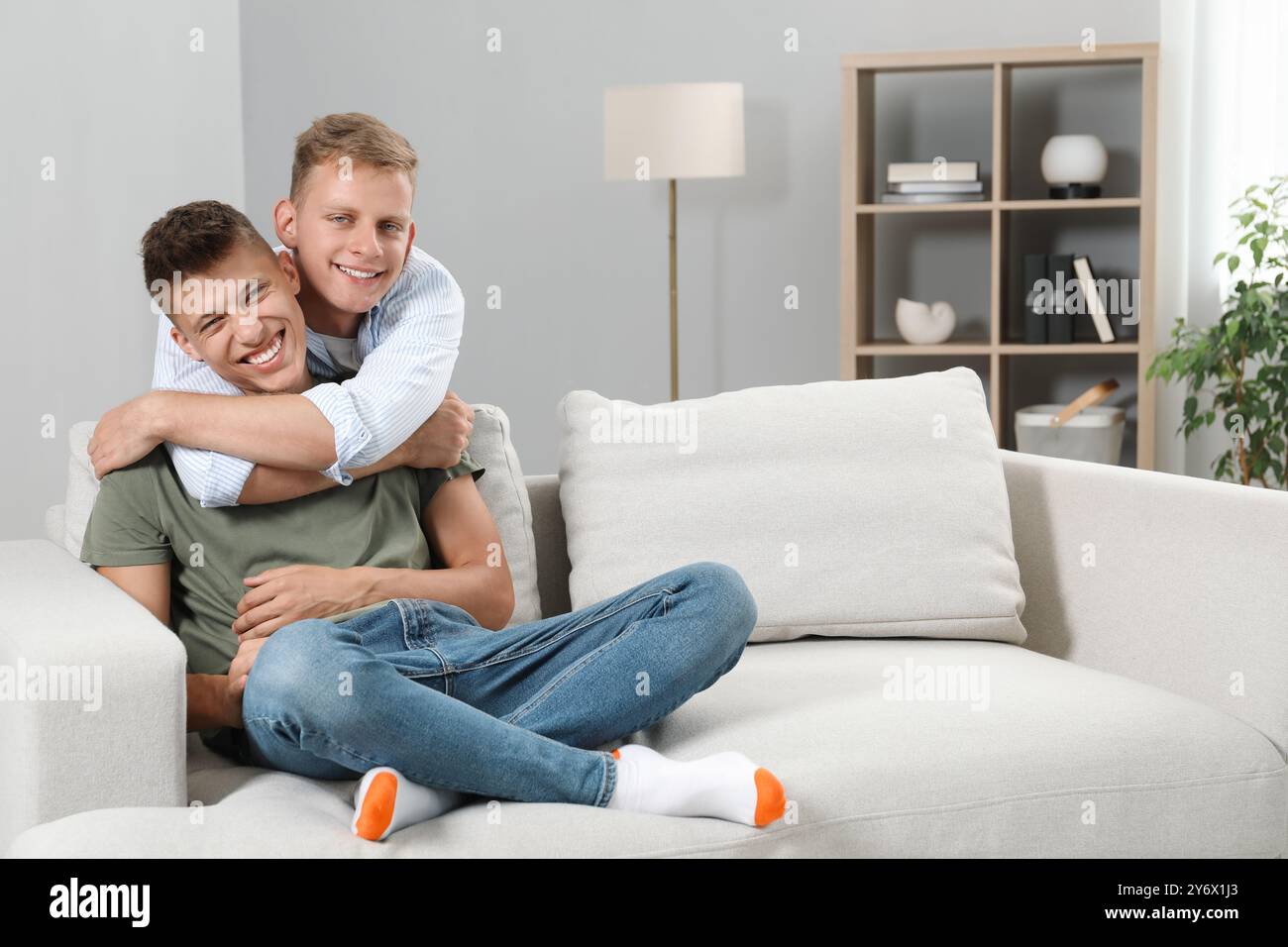 Happy brothers hugging at home. Space for text Stock Photo - Alamy