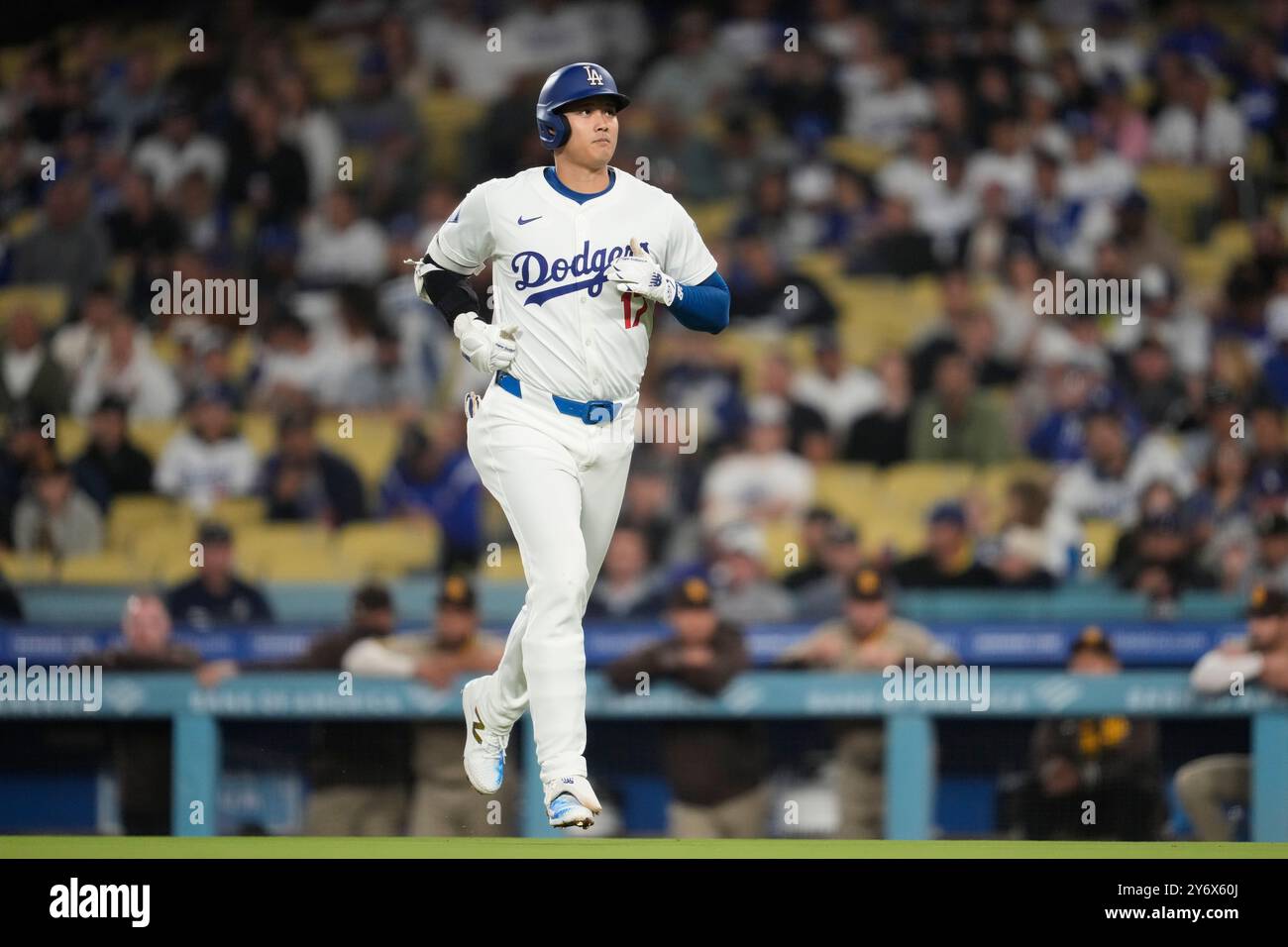Los Angeles Dodgers' Shohei Ohtani makes his way back to the dugout ...