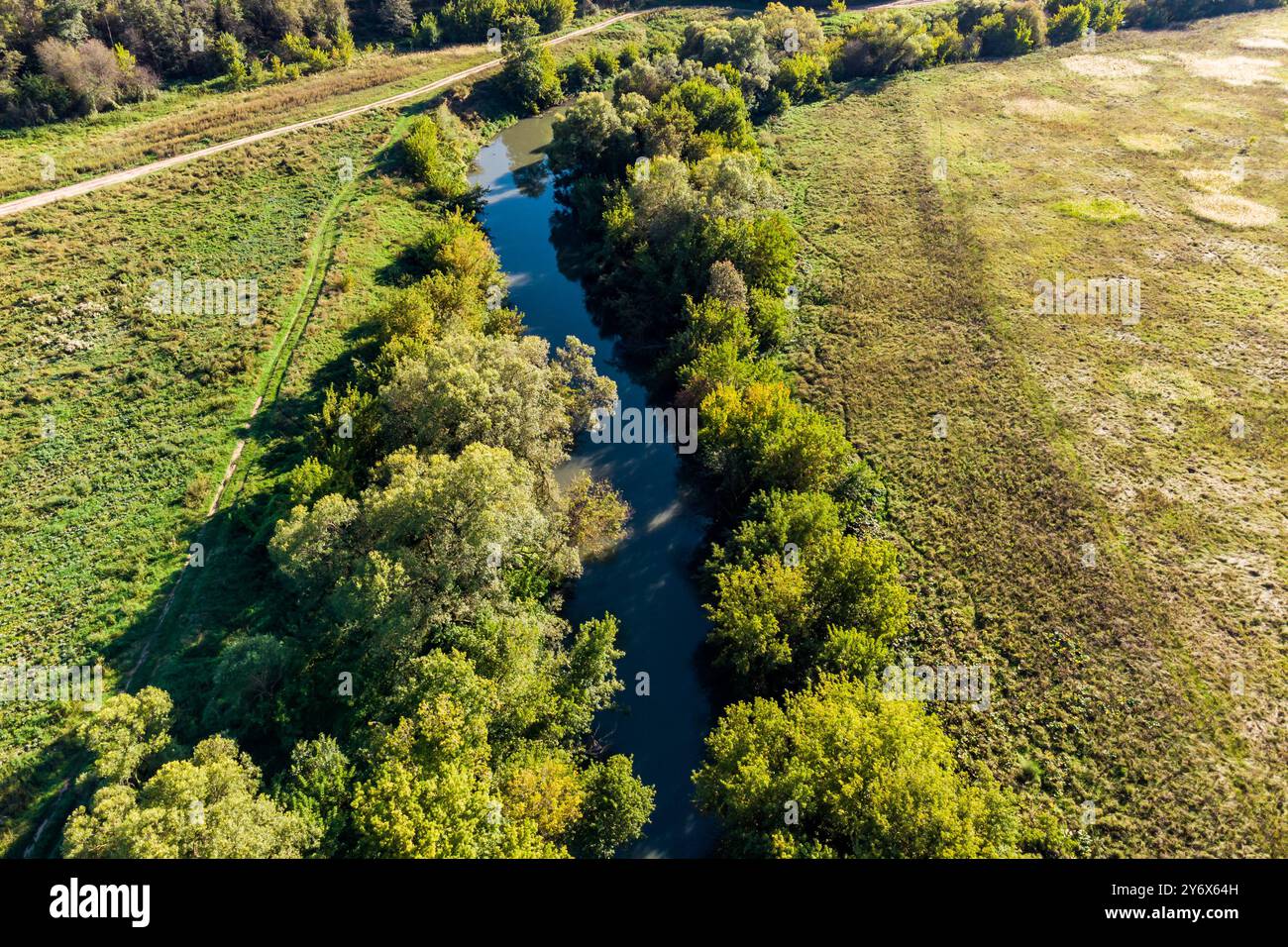 Aerial view of river bed surrounded by fields Stock Photo - Alamy