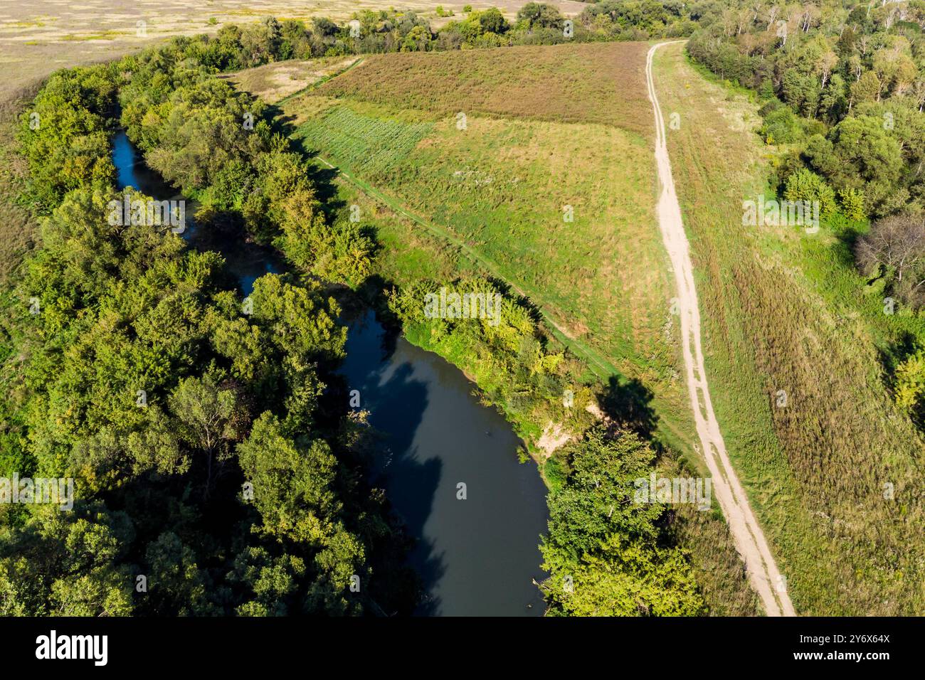 Aerial view of a river bed with overgrown banks Stock Photo - Alamy
