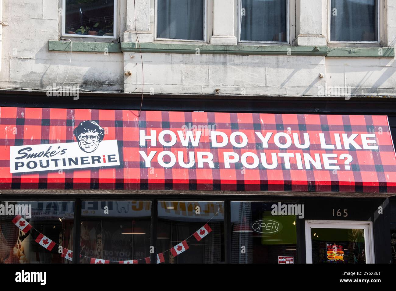 Smoke's Poutinerie sign on Water Street in downtown St. John's ...