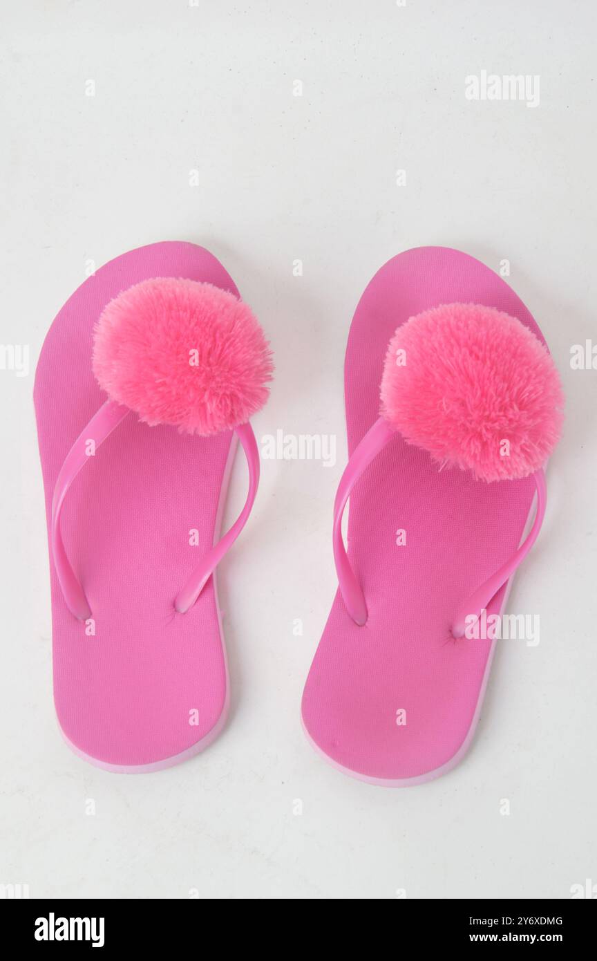 pink cute flip-flops on white background Stock Photo - Alamy