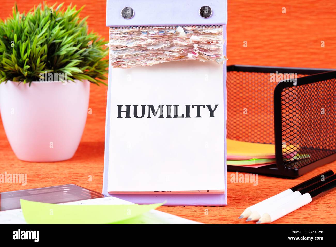 Lifestyle concept. HUMILITY word on a blank desktop calendar page on an ...