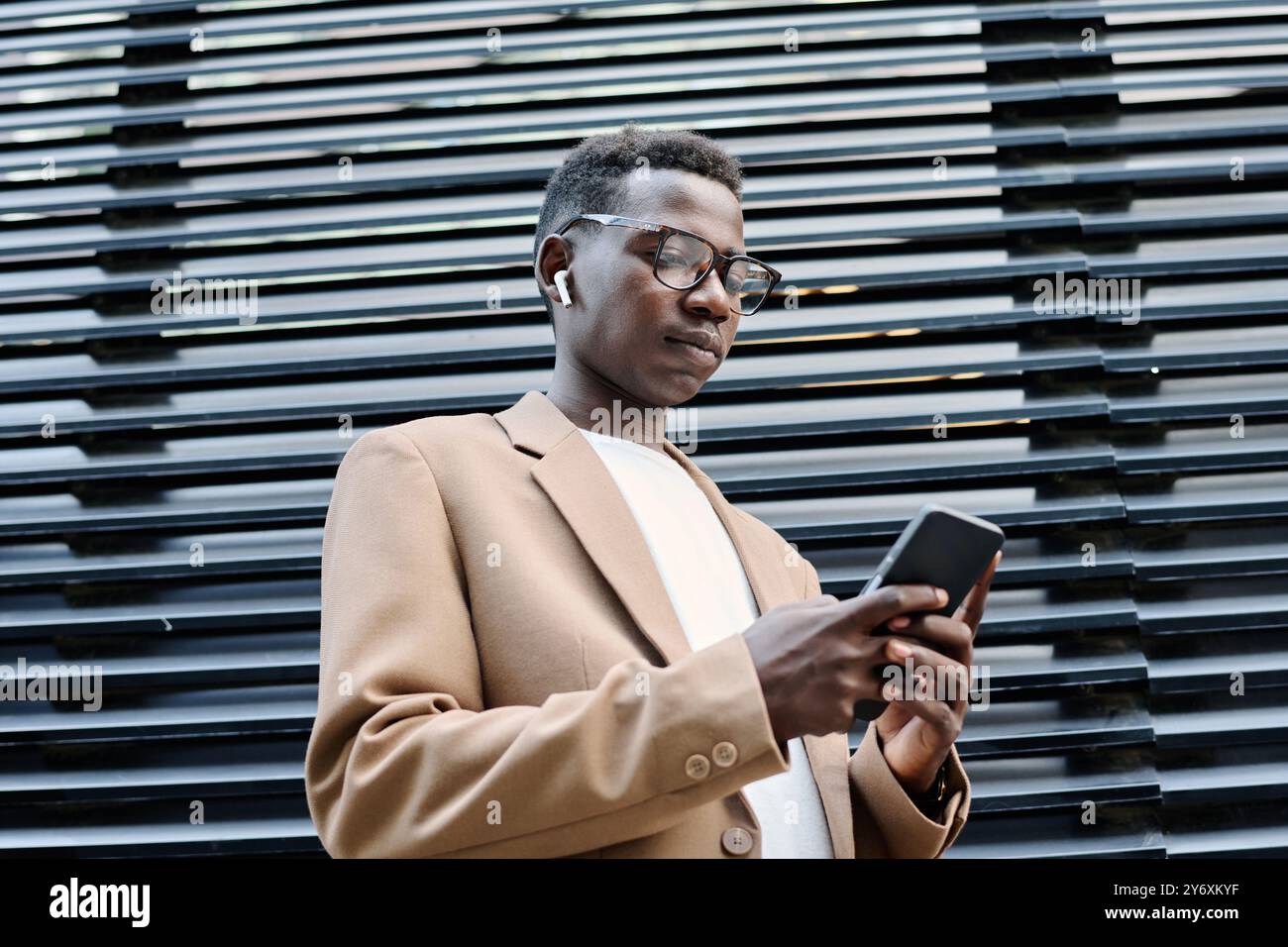 Gen Z Businessman Texting Message On Smartphone Stock Photo - Alamy
