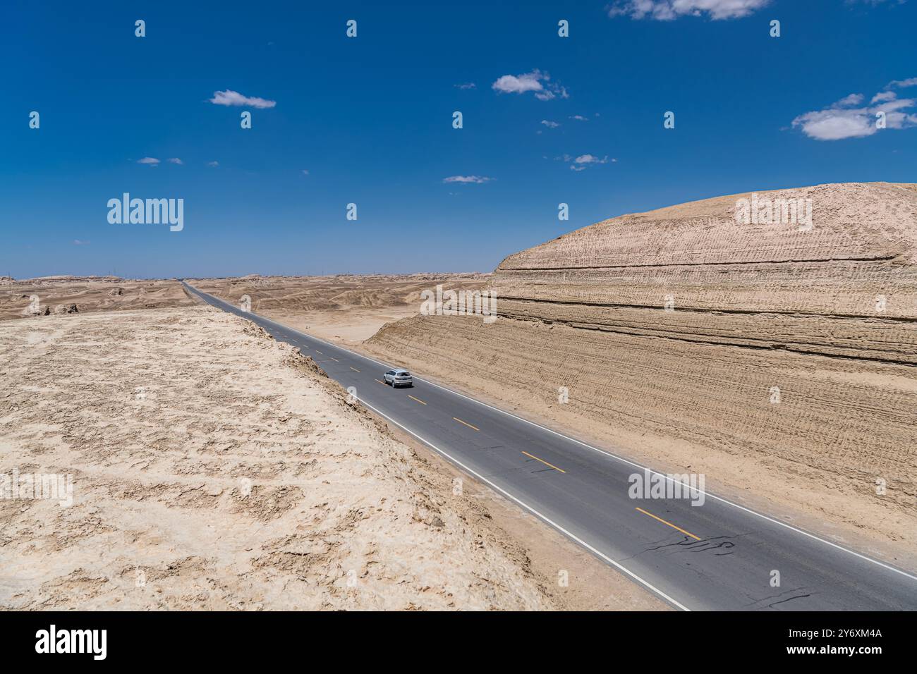 The highway going through Yadan geoform in Qinghai, China. Copy space ...