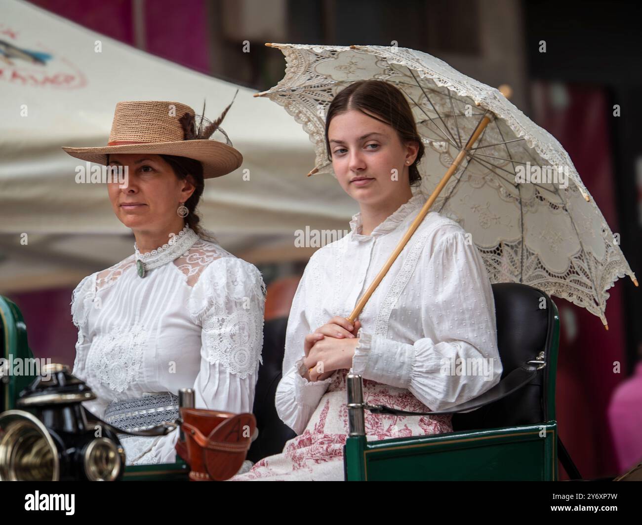 Group of people dressed in traditional Andalusian costumes, riding in a ...